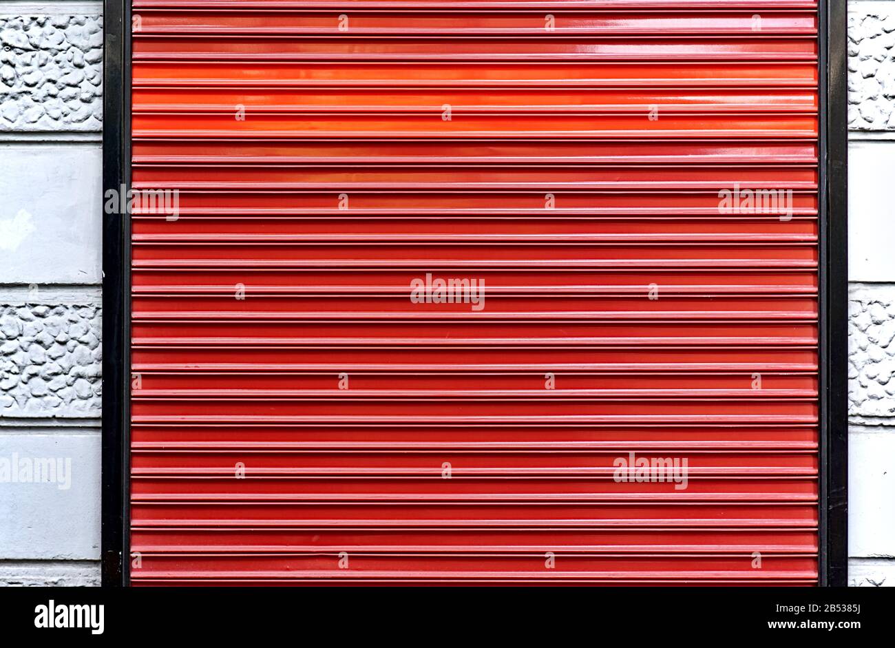 Red aluminum roller shutter garage door Stock Photo - Alamy