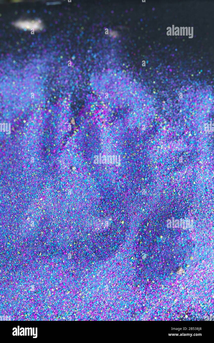 Multi-colored powder sprayed on black backgrounds Stock Photo - Alamy