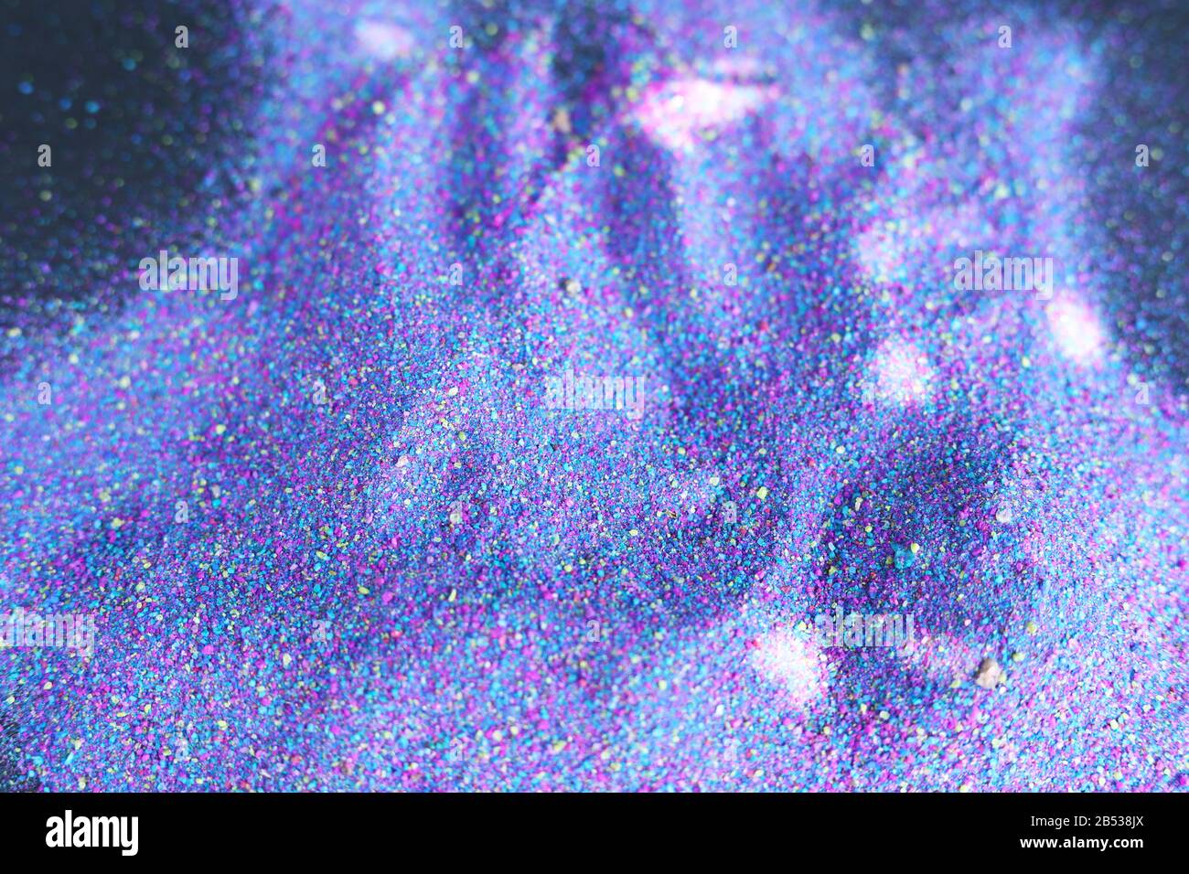 Multi-colored powder sprayed on black backgrounds Stock Photo - Alamy