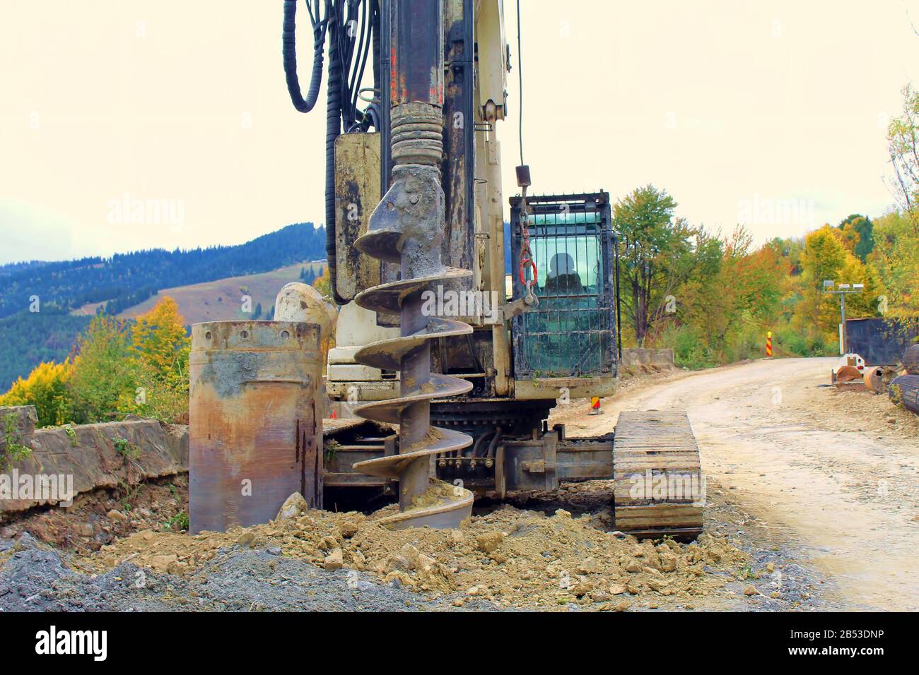 Machinery drilling on construction site Stock Photo - Alamy
