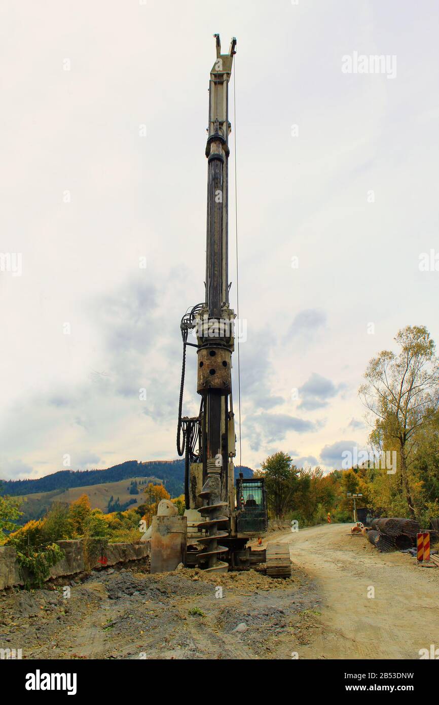 Machinery drilling on construction site Stock Photo - Alamy
