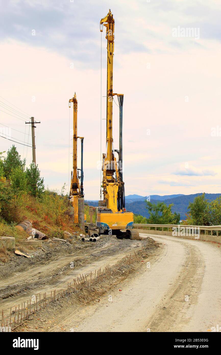 Machinery drilling on construction site Stock Photo - Alamy