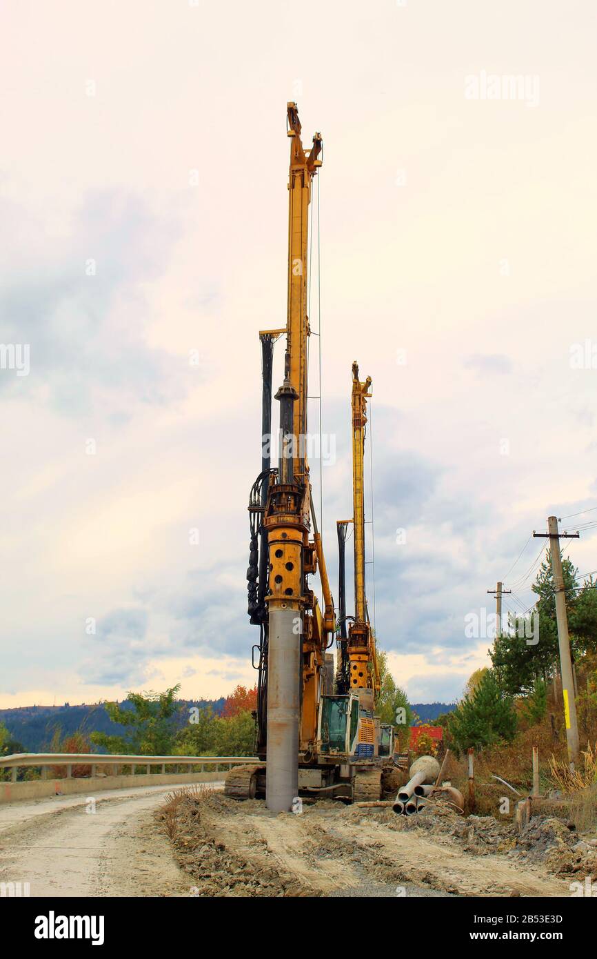 Machinery drilling on construction site Stock Photo - Alamy