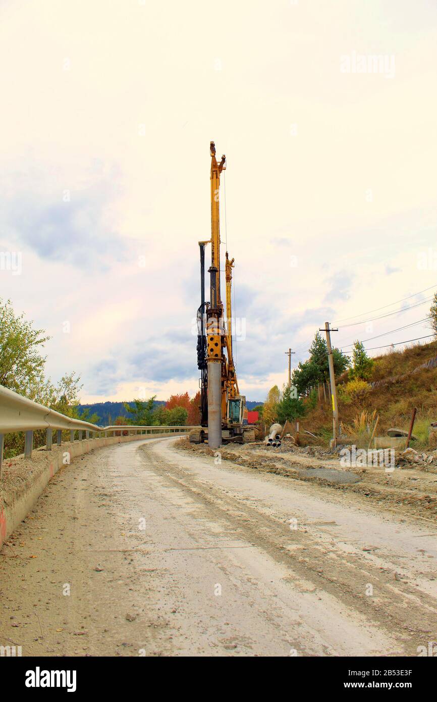 Machinery drilling on construction site Stock Photo - Alamy