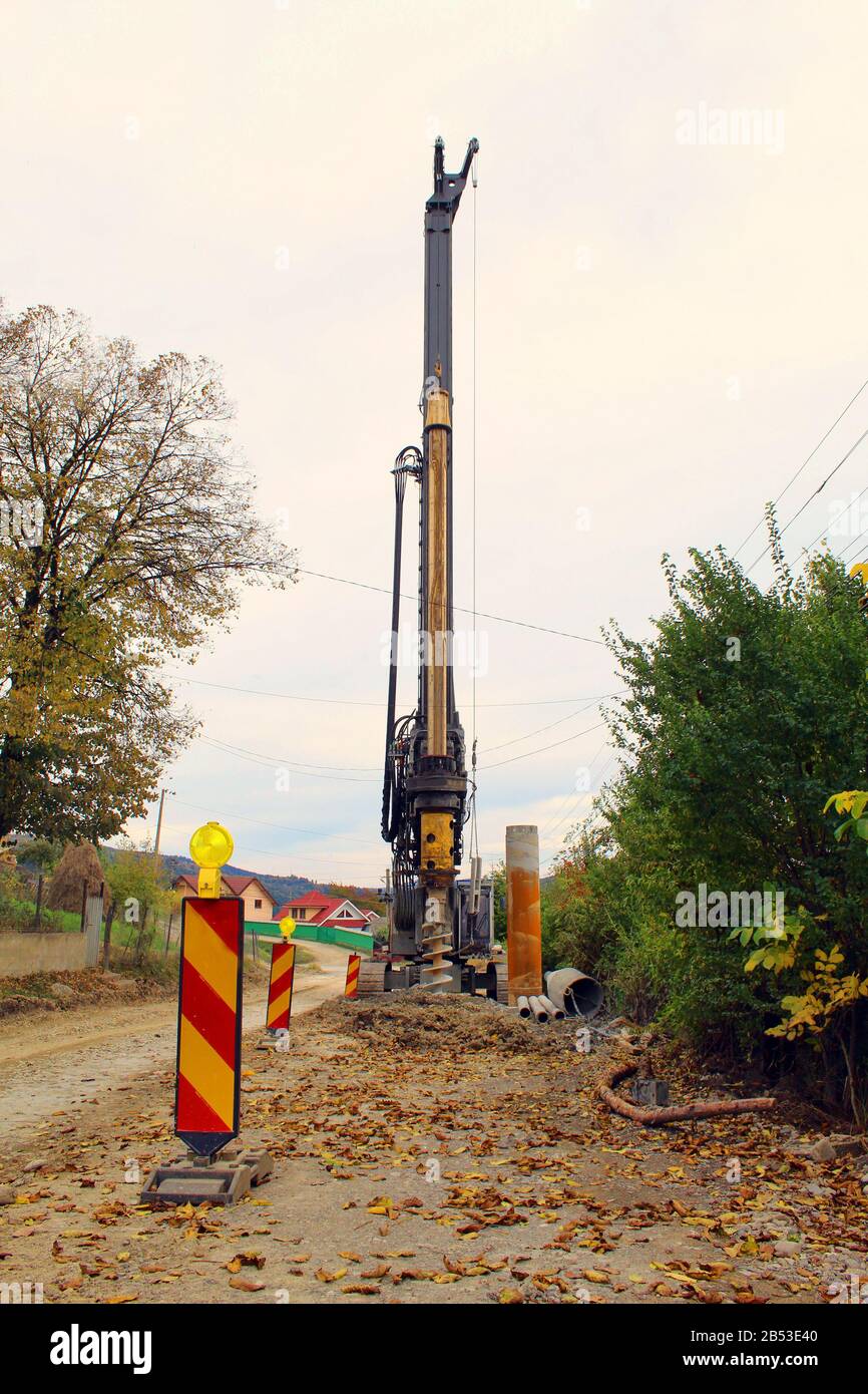 Machinery drilling on construction site Stock Photo - Alamy