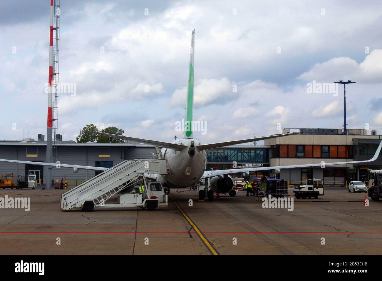Back view of airplane in airport Stock Photo - Alamy