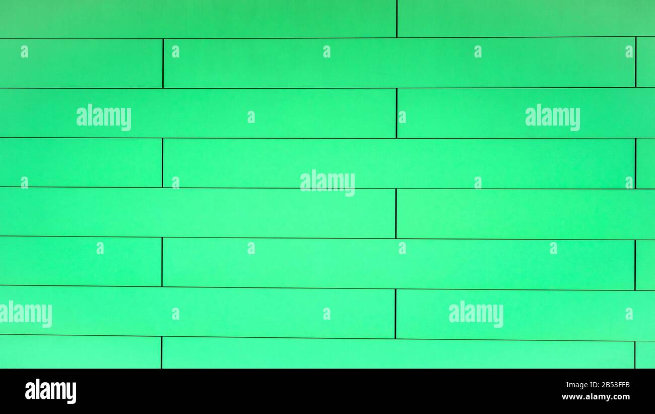 A lot of green frames on house wall are rectangular in shape. Building ...