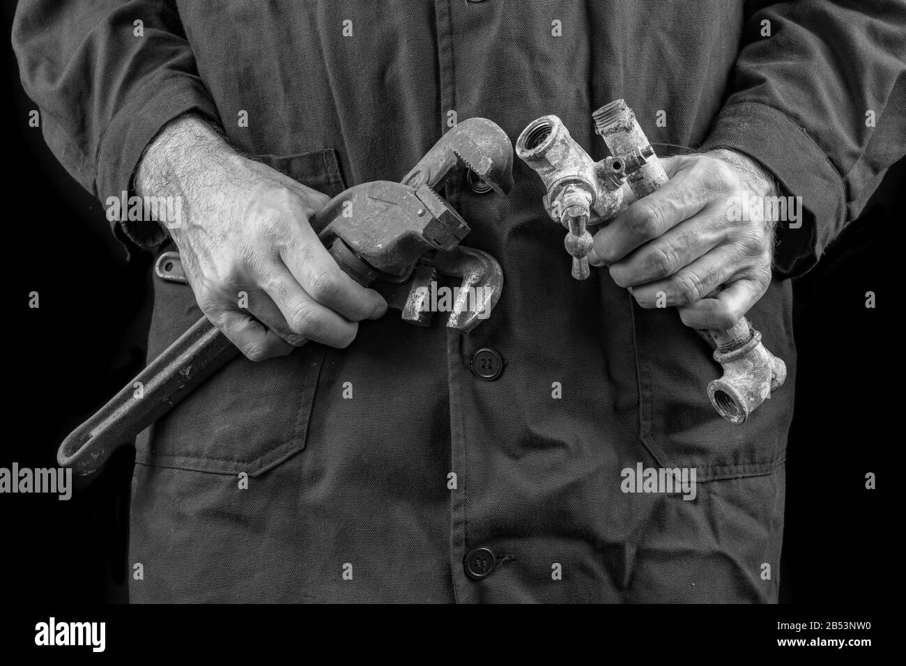 Hand holding pipe Black and White Stock Photos & Images - Alamy