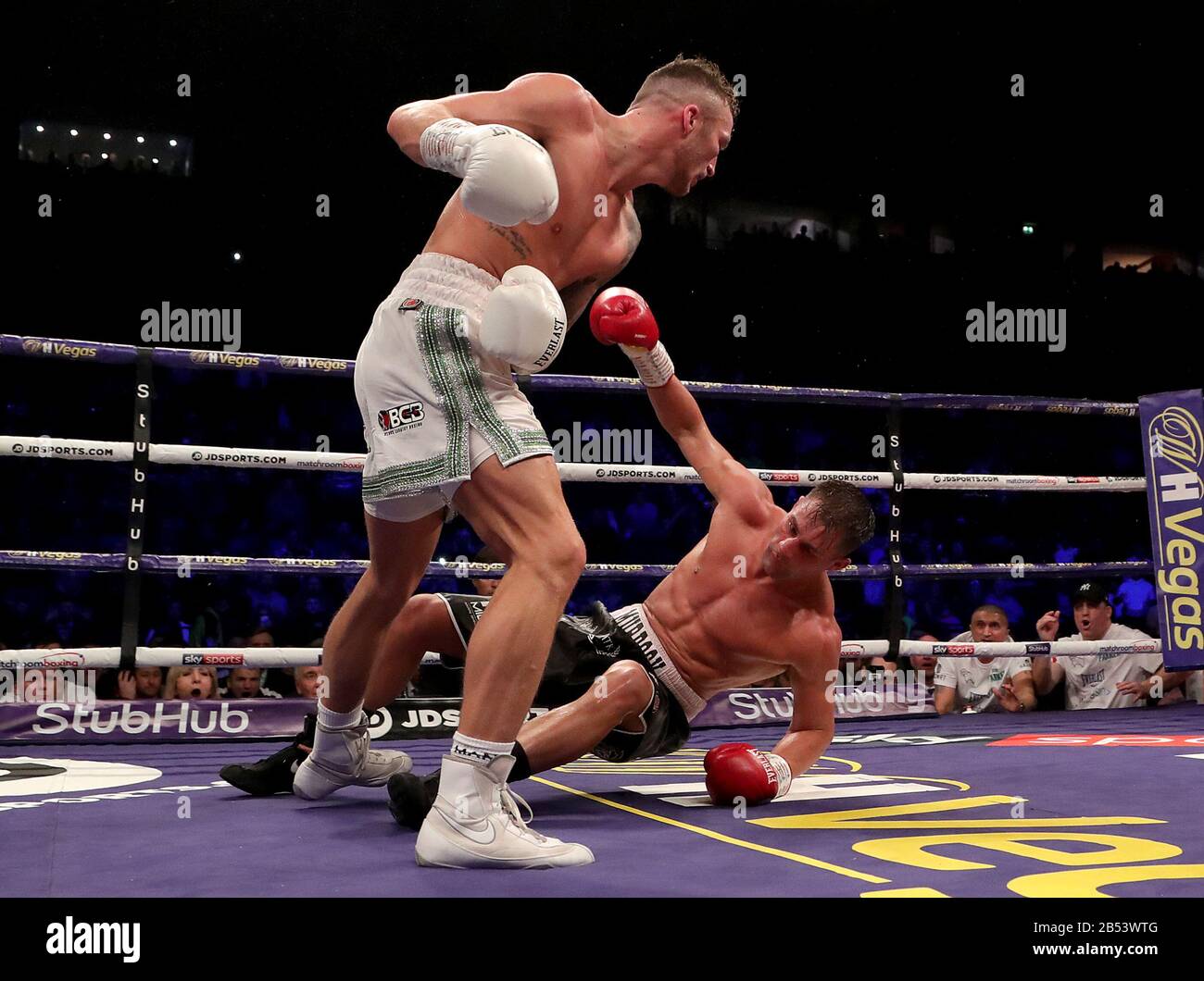 Zach Parker (left) knocks down Rohan Murdock in their WBO International ...