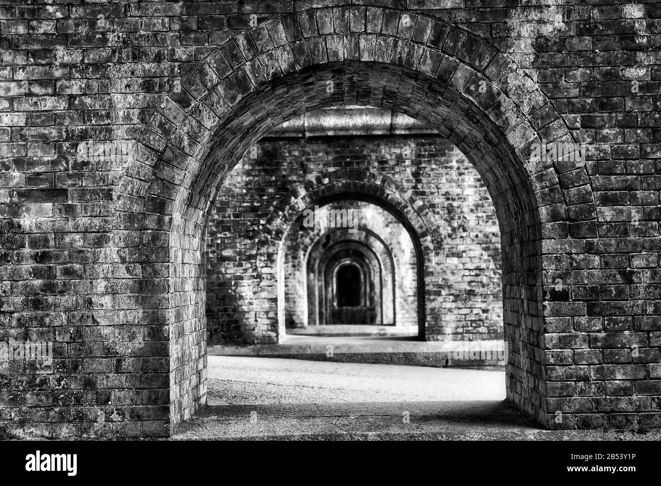 Throught the diminishing creepy perspective of contrast arches in old ...