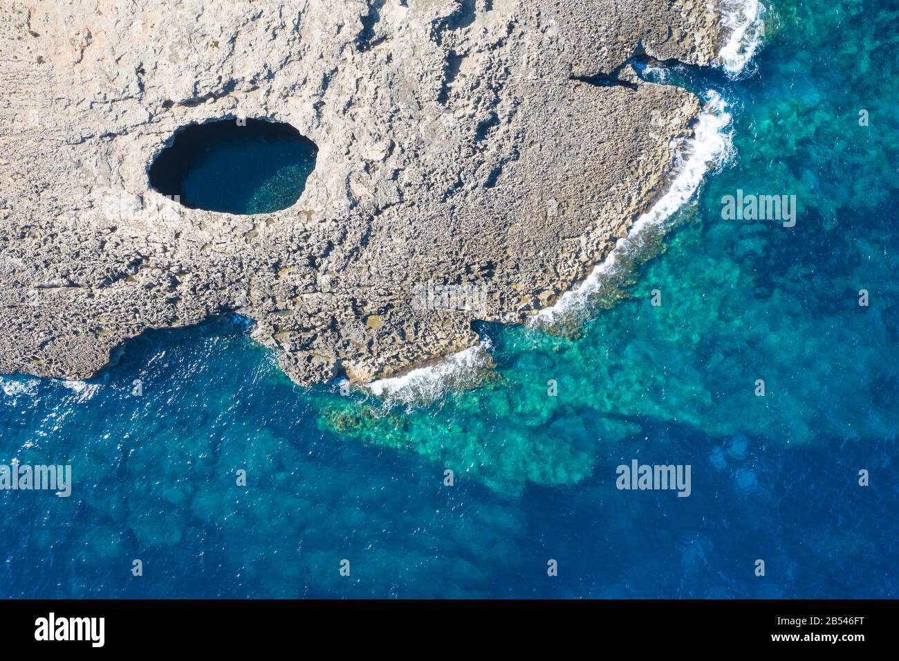 Big natural hole in the rock. Coral Lagoon. Malta island Stock Photo ...