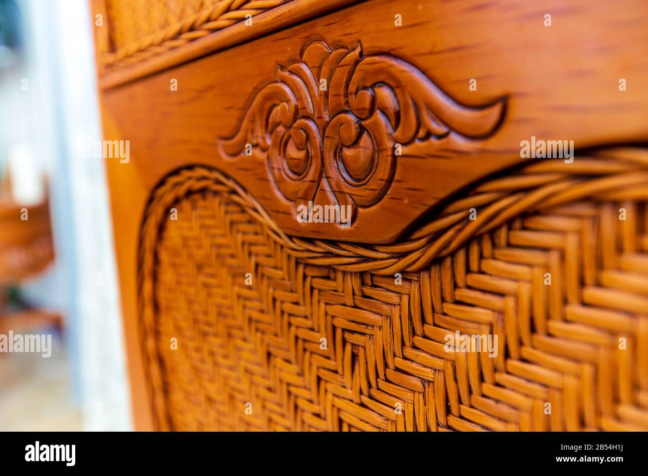element of the back of a wooden antique chair made of dark wood close ...