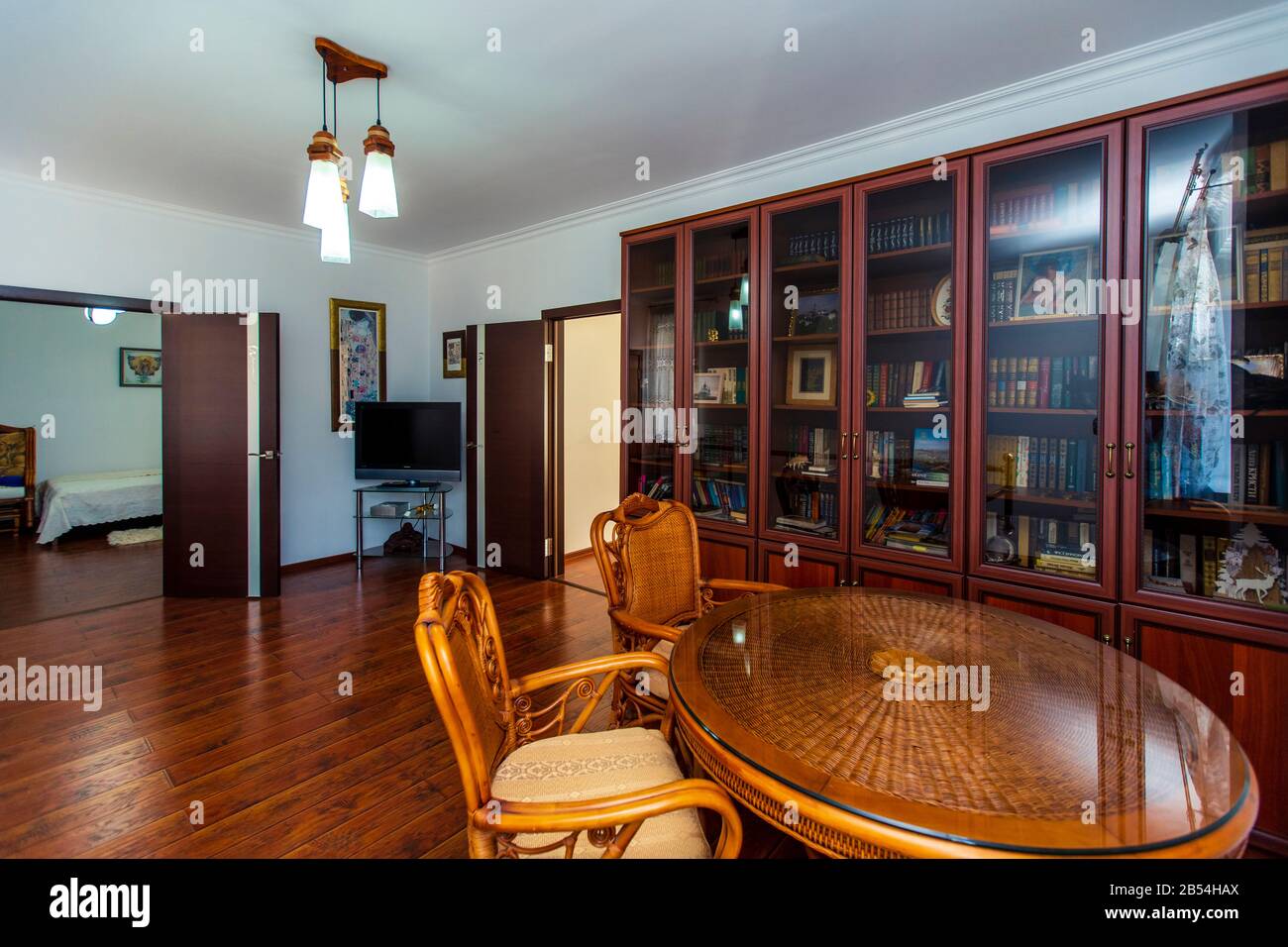 the library is on the second floor of the house, where a wooden ...