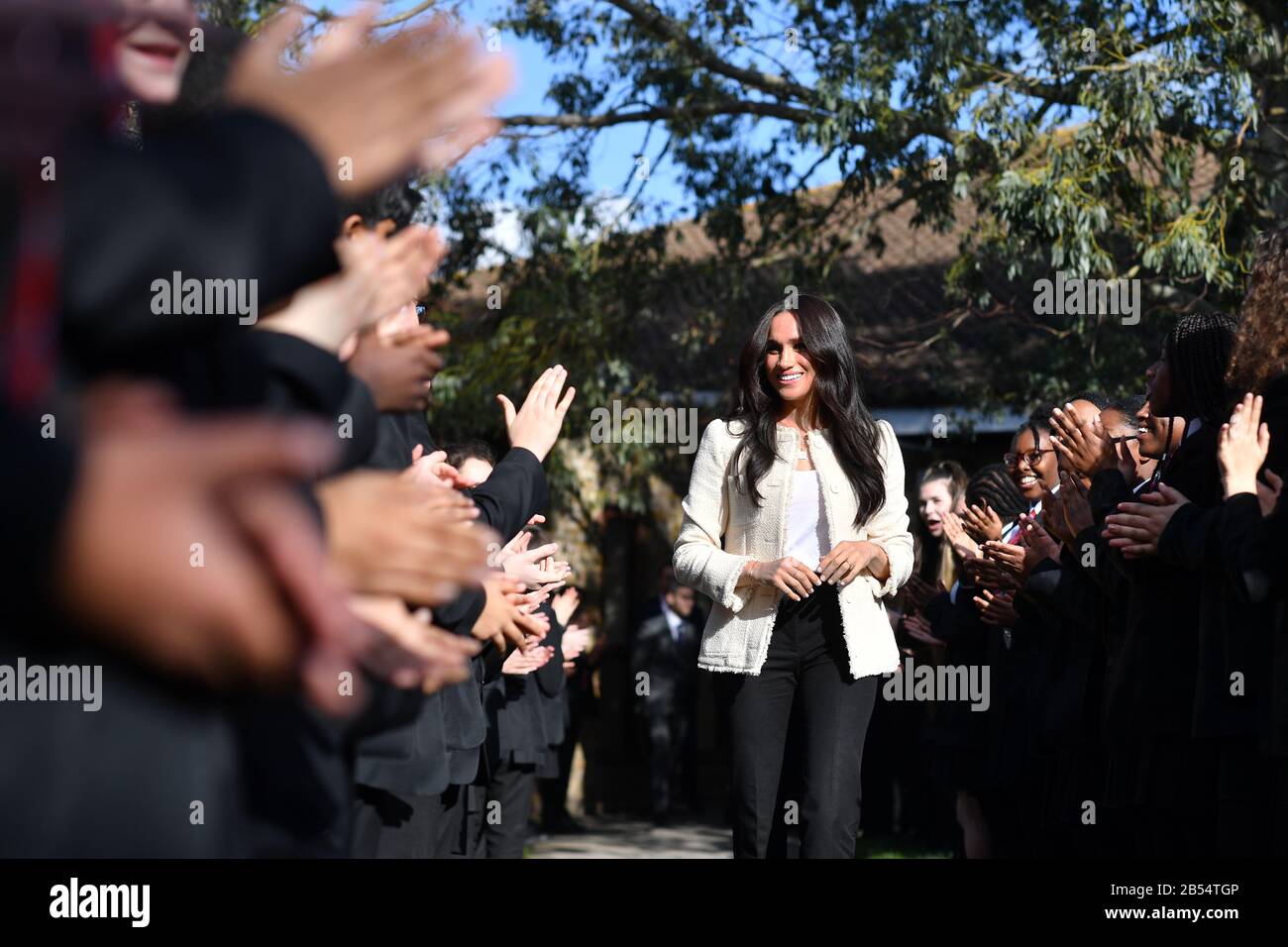 The Duchess of Sussex is greeted by pupils at the Robert Clack Upper ...