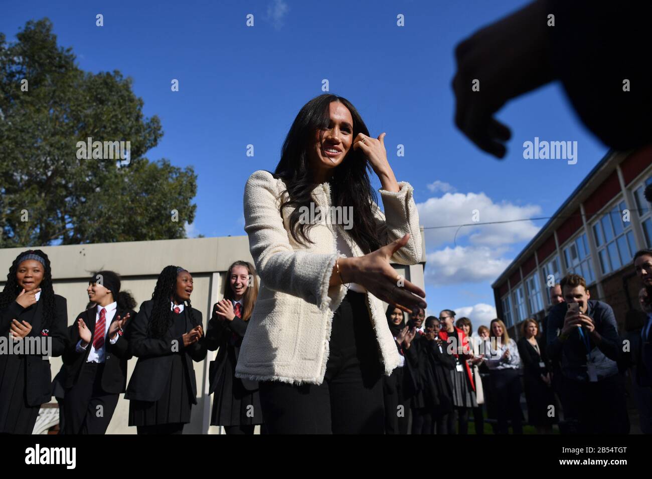 The Duchess of Sussex is greeted by pupils at the Robert Clack Upper ...
