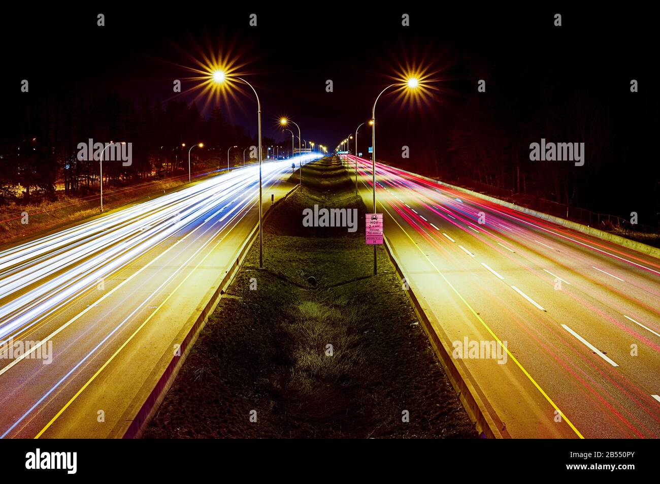 Light trails on highway at night. View from pedestrian overpass Stock ...