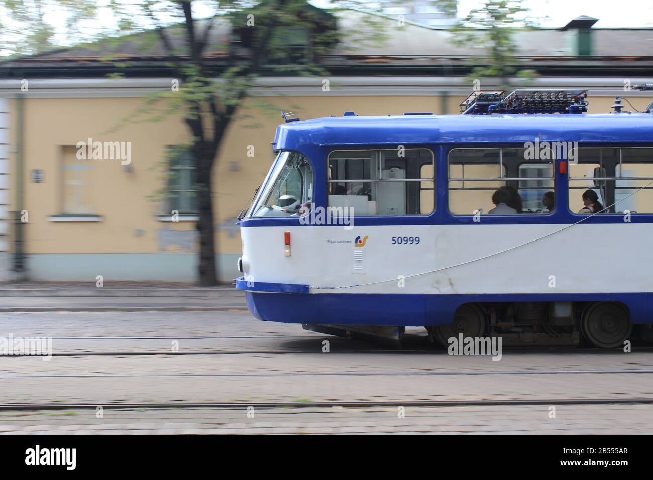 Tram go fast to station Stock Photo - Alamy