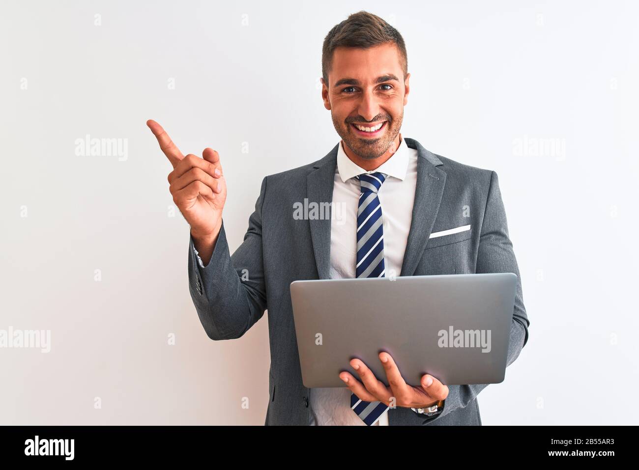 Young handsome business man working using computer laptop over isolated ...