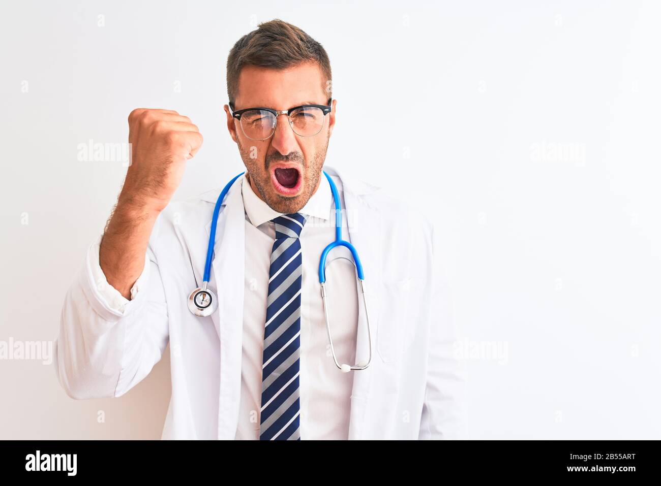 Young handsome doctor man wearing stethoscope over isolated background ...