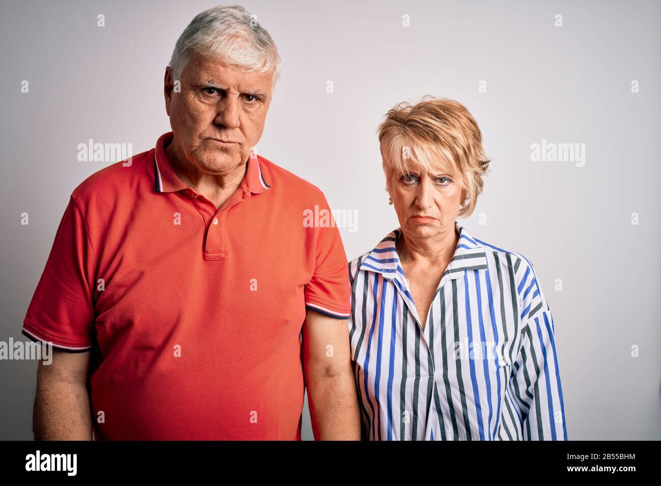 Senior beautiful couple standing together over isolated white ...