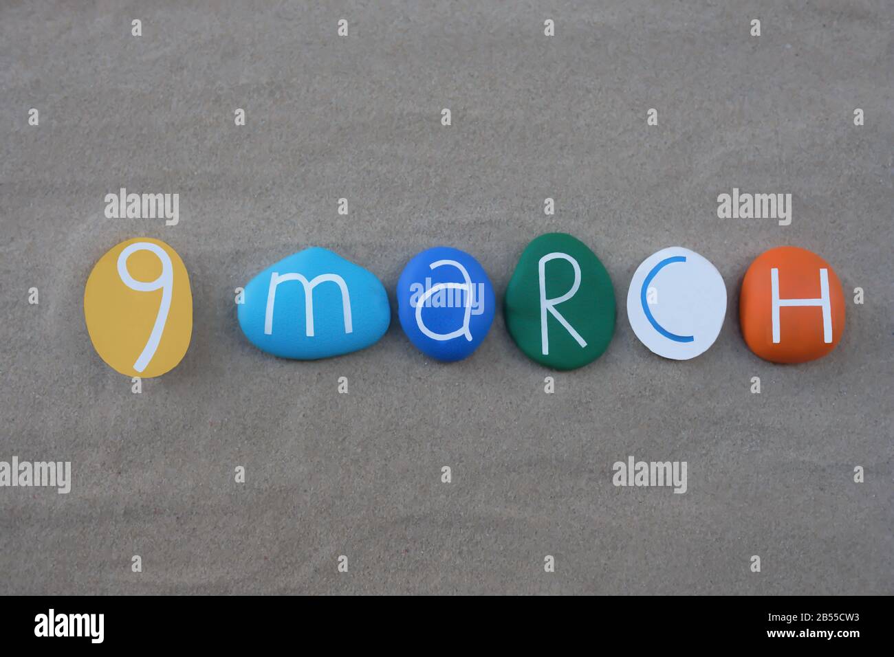 9 March, calendar date composed with colored and carved stones over ...