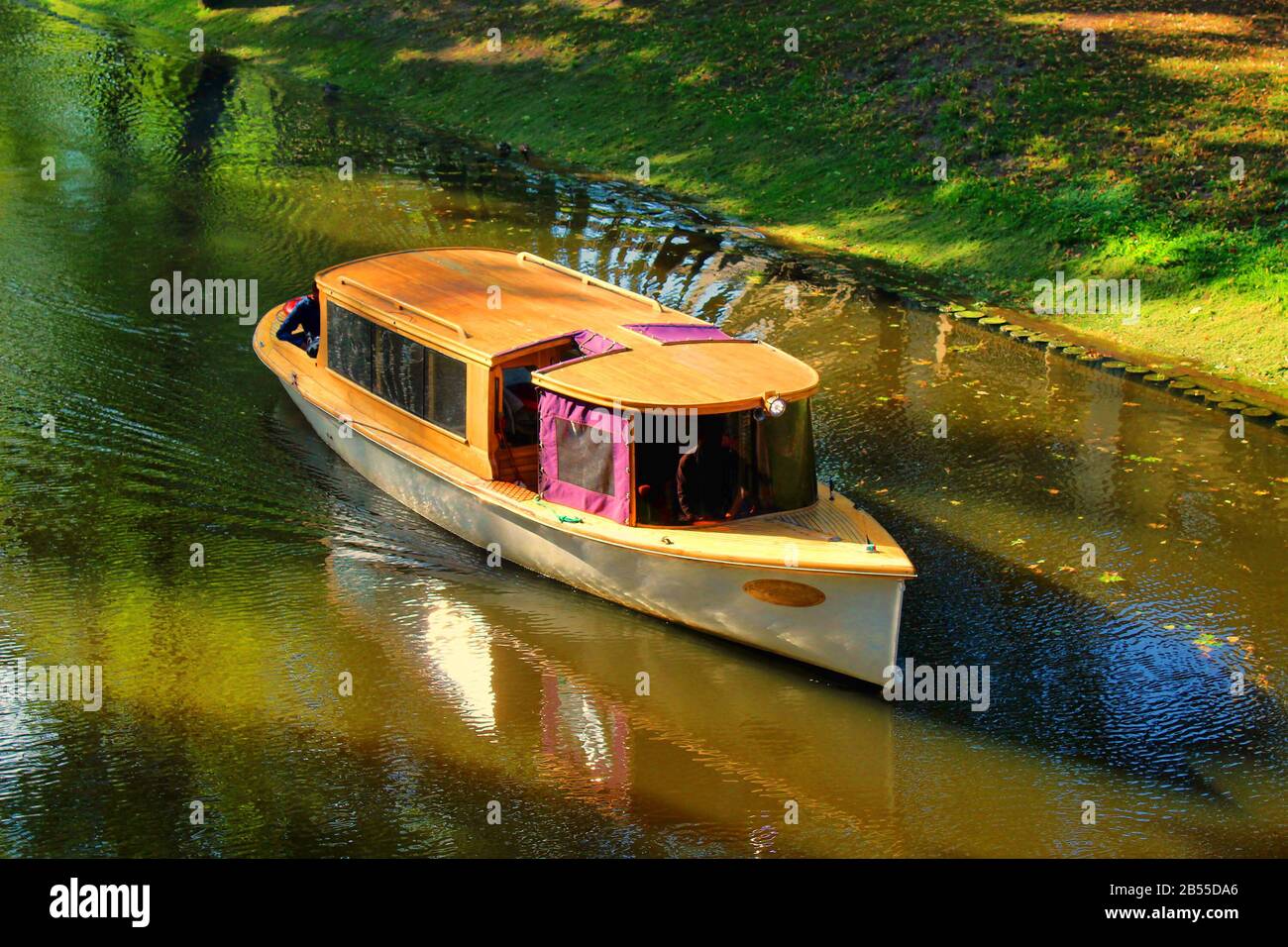 Wooden boat on the river Stock Photo - Alamy