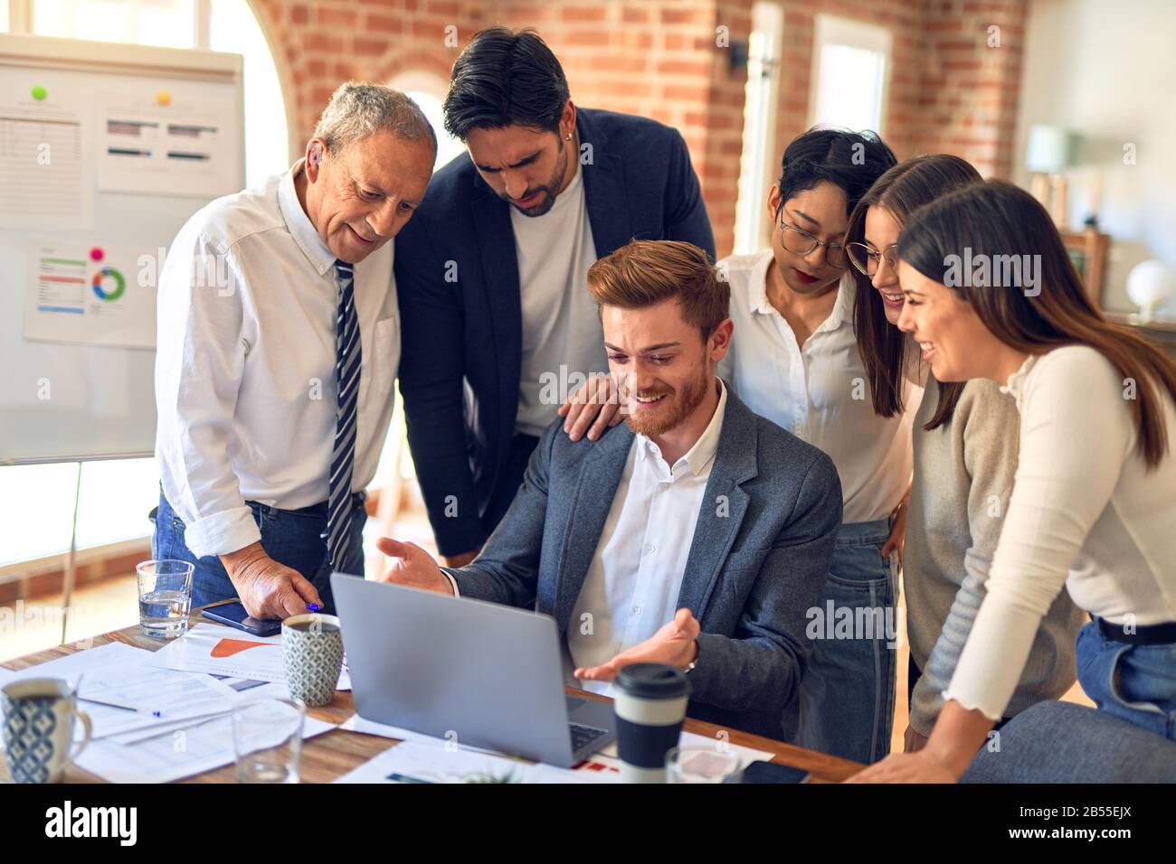 Group of business workers smiling happy and confident. One of them ...