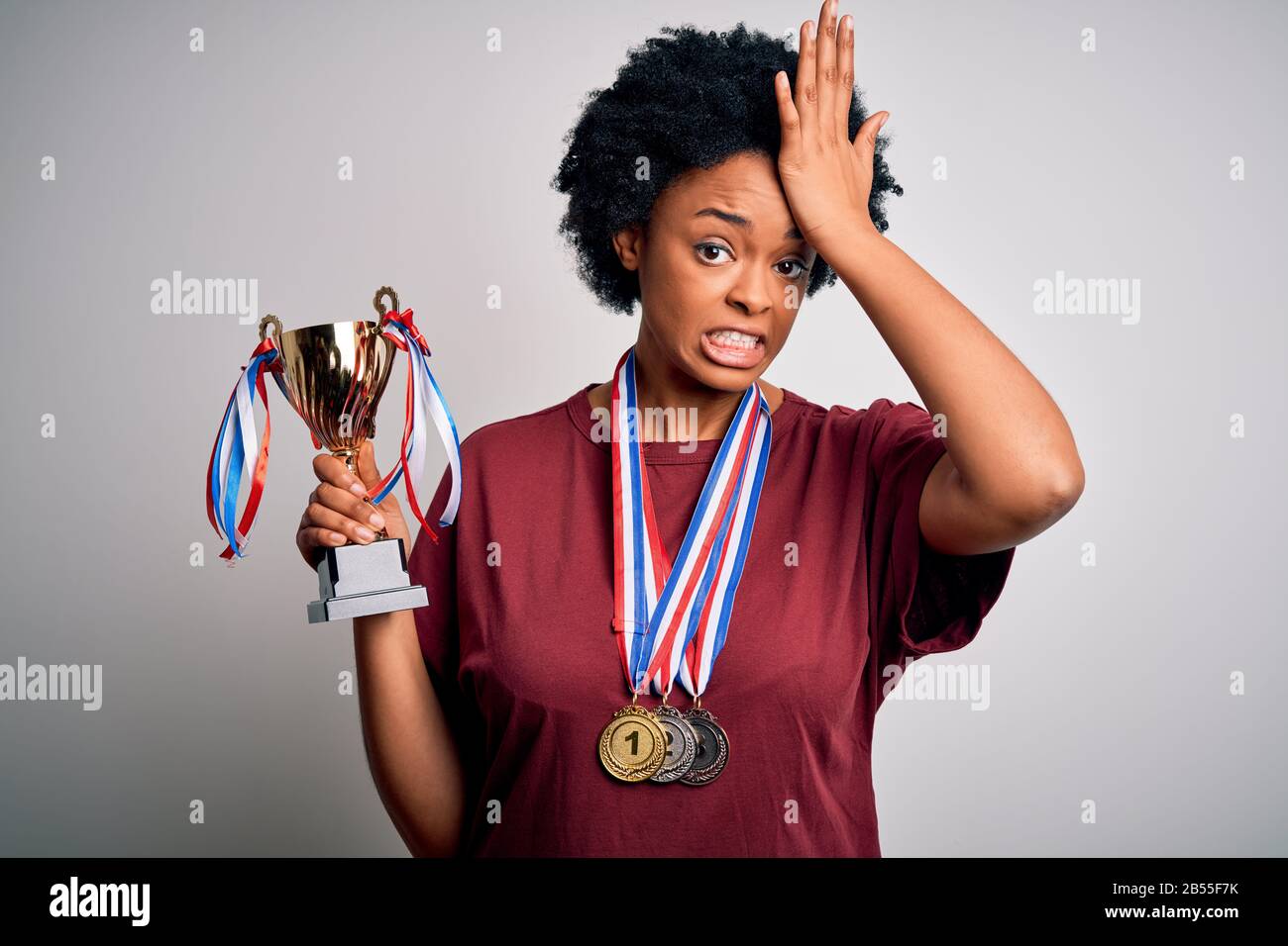 Young African American afro athlete woman with curly hair wearing ...