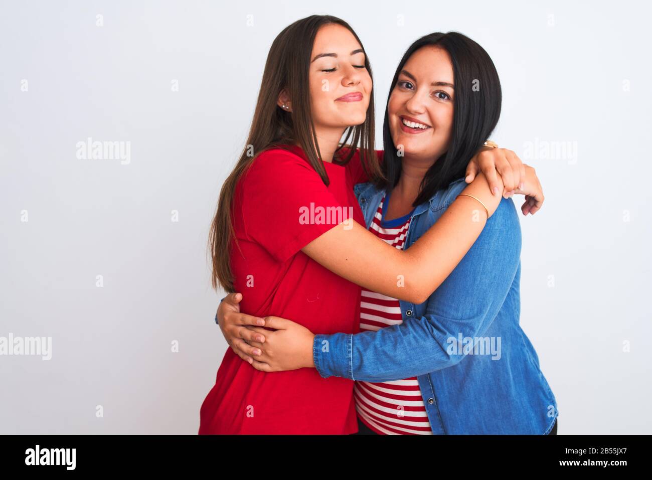 Young beautiful women wearing casual clothes standing over isolated ...