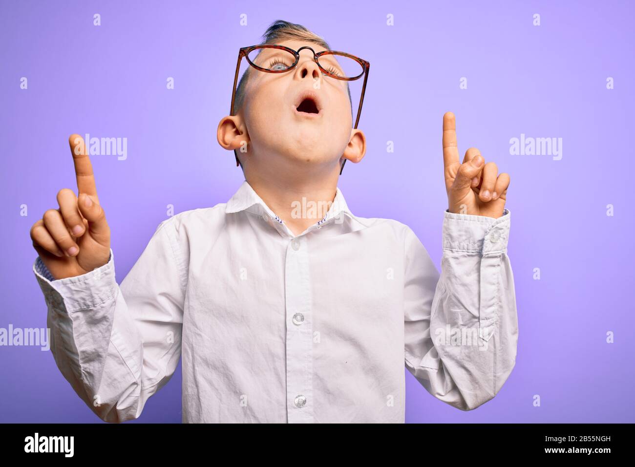 Young little caucasian kid with blue eyes wearing glasses and white ...