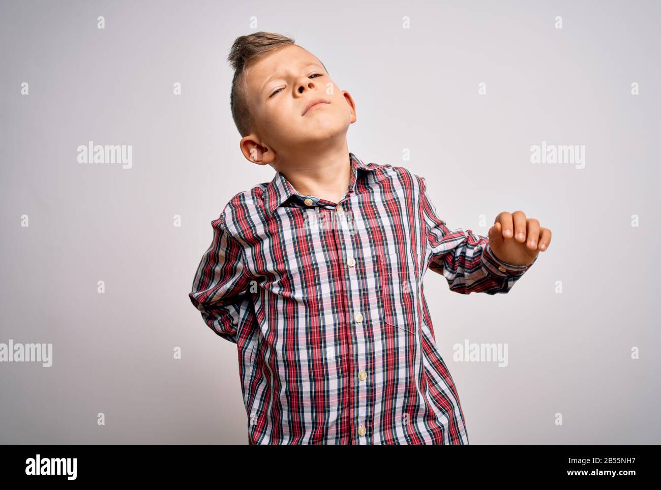 Young little caucasian kid with blue eyes wearing elegant shirt ...