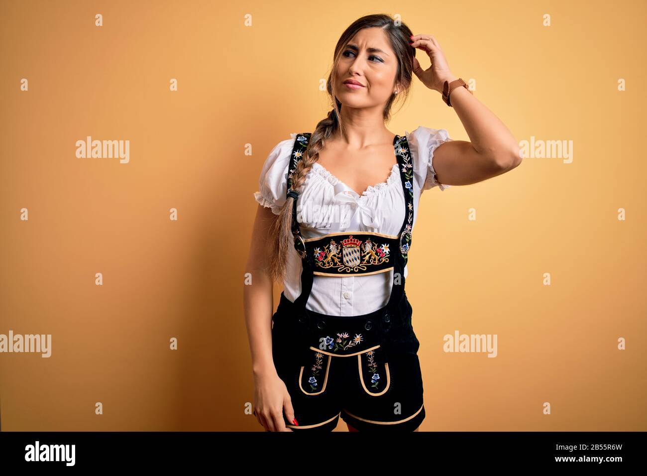 Young beautiful brunette german woman celebrating Octoberfest wearing ...