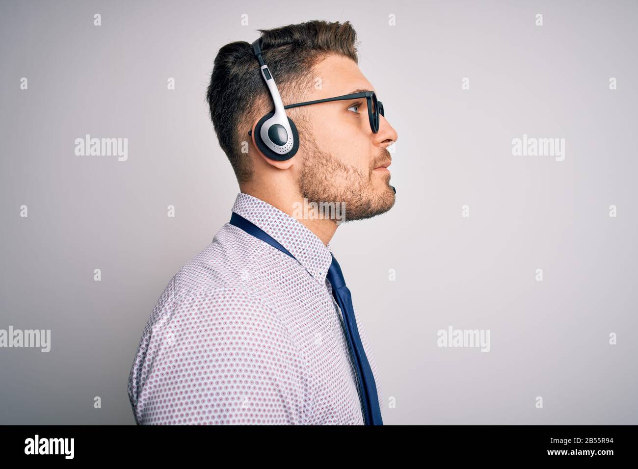 Young call center operator business man with blue eyes wearing glasses ...