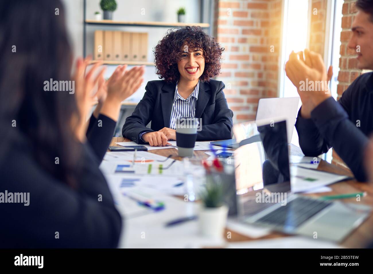 Group of business workers smiling happy and confident. Working together ...