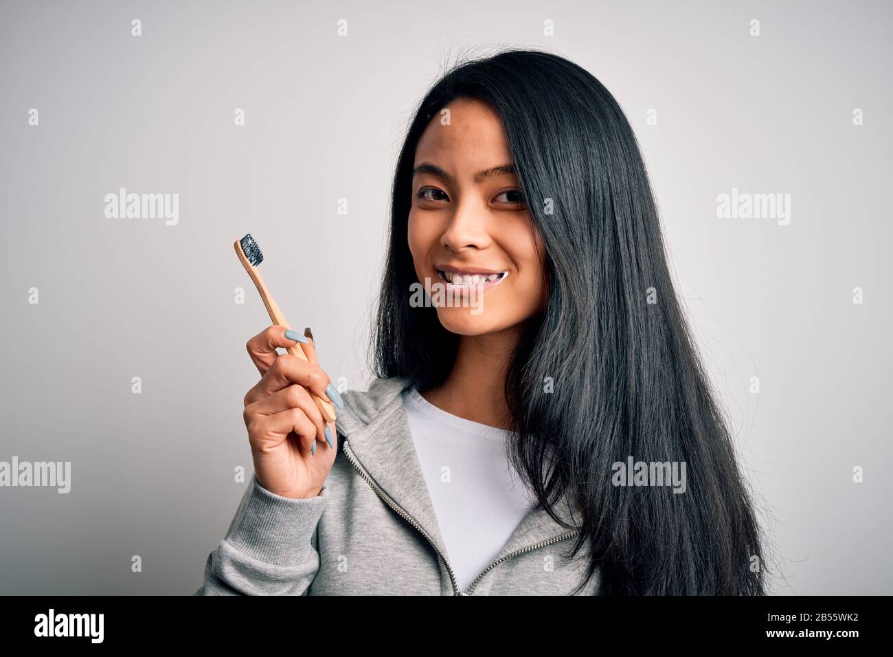 Young beautiful woman smiling happy. Standing with smile on face ...
