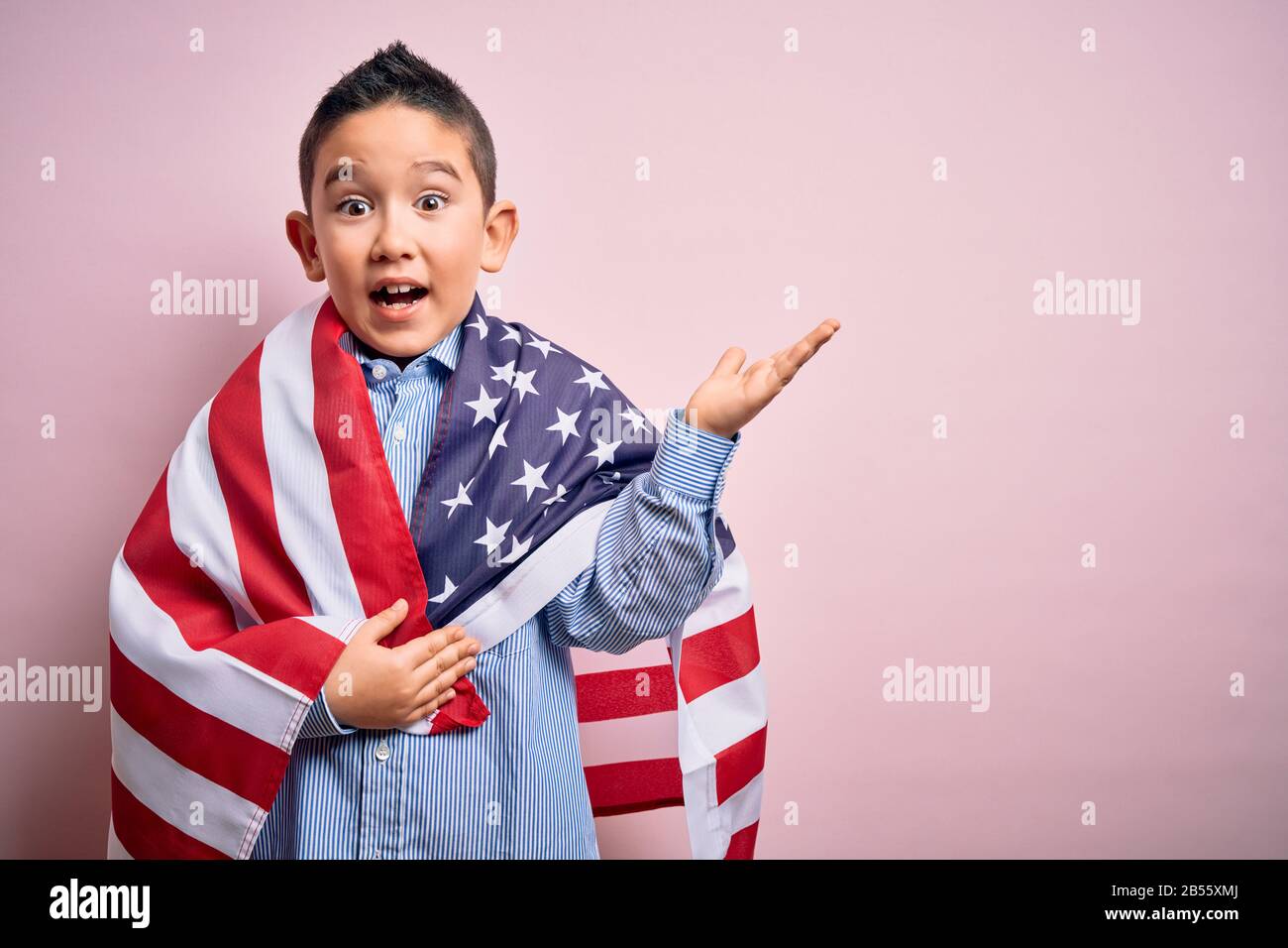 Young little patriotic boy kid covered on united states of america flag ...
