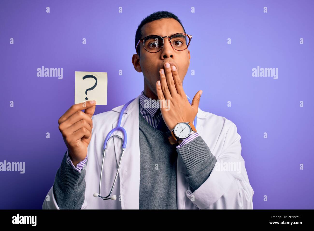 Handsome african american doctor man wearing stethoscope holding ...