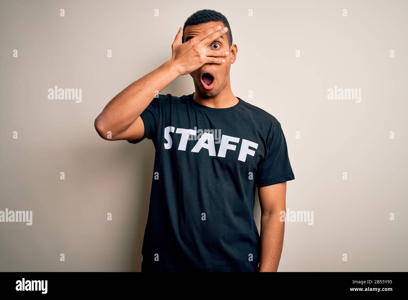 Young handsome african american worker man wearing staff uniform over ...