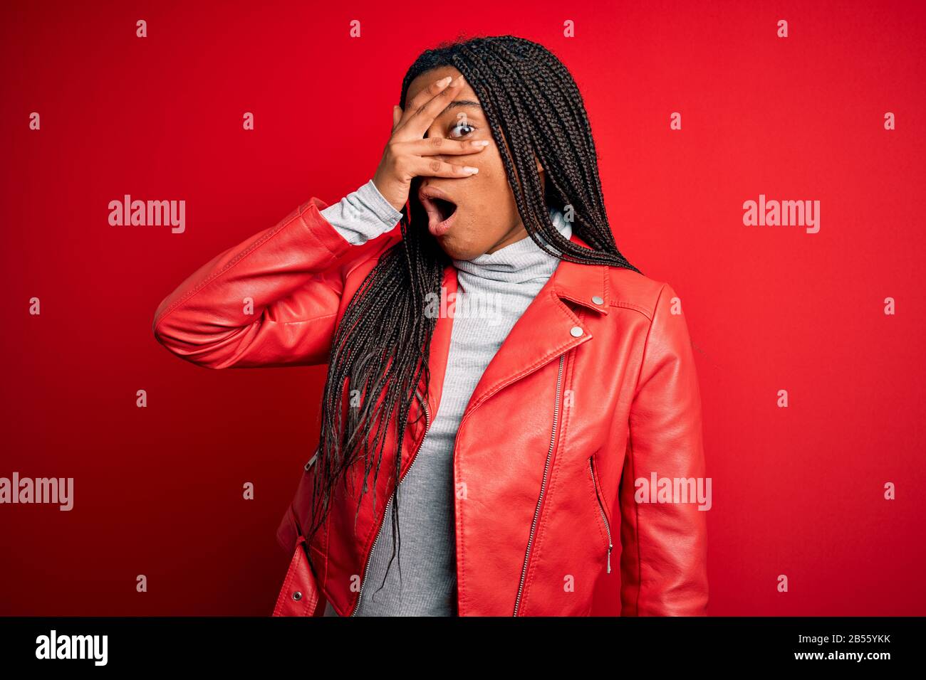 Young african american woman wearing cool fashion leather jacket over ...
