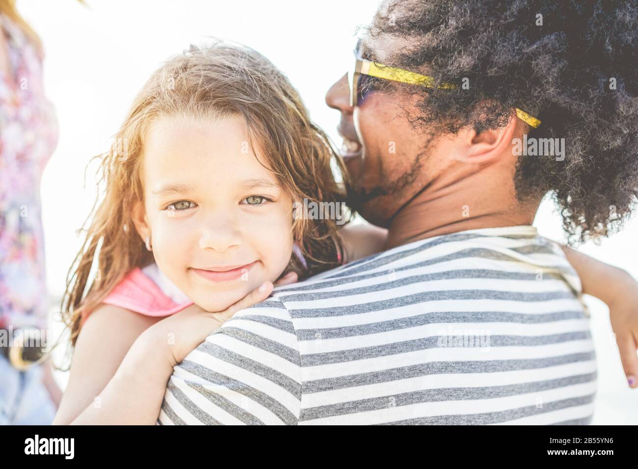 Smiling latin family hugging hi-res stock photography and images - Alamy