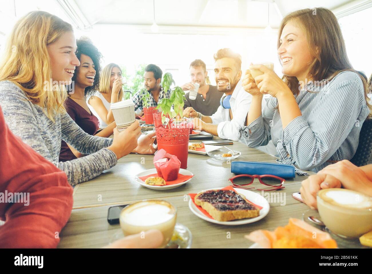 Happy friends having coffee break at bar cafe - Young hipster people ...