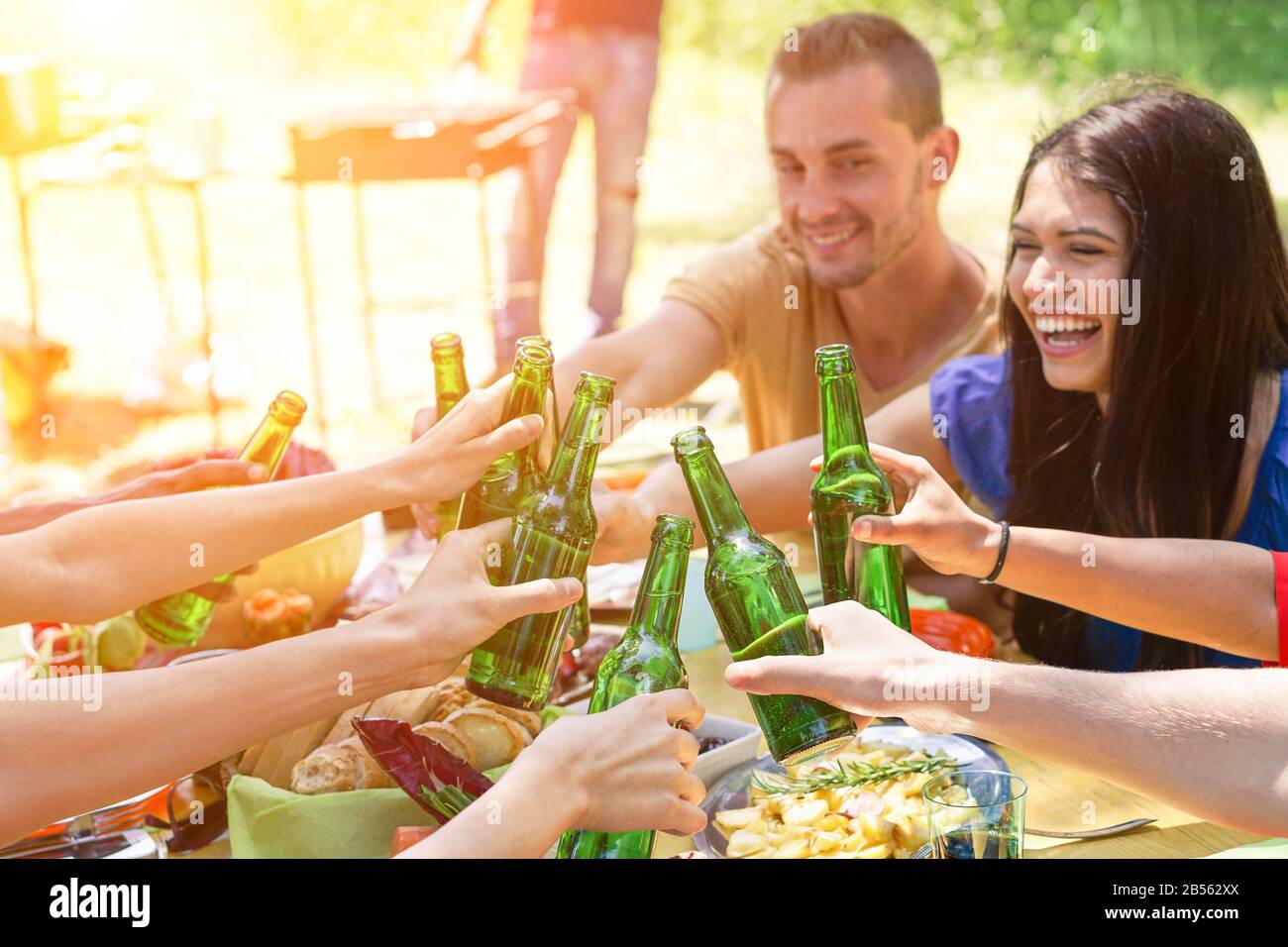 Group of multiracial students having barbecue on sunny day - Young ...