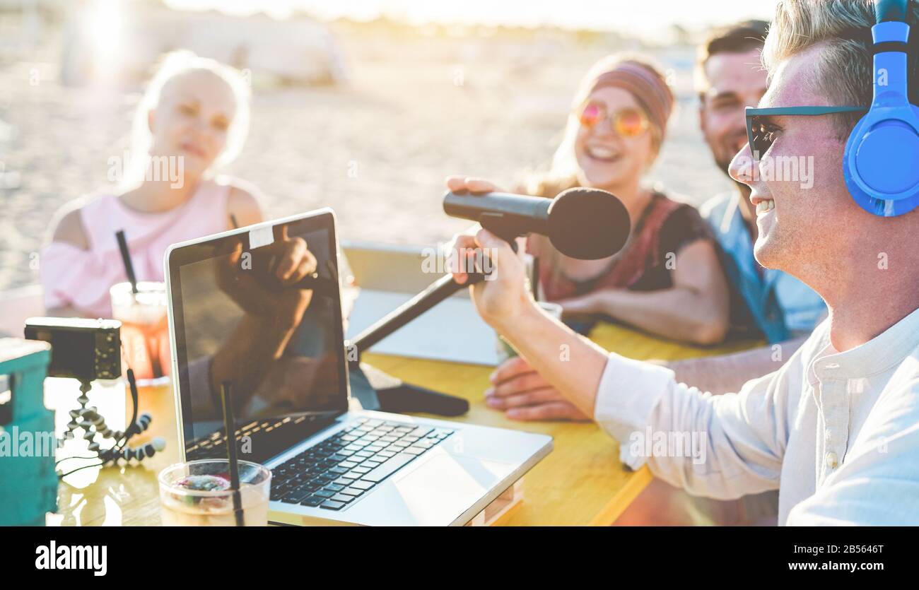 Millennials people making a video feed online at beach party - Speaker ...