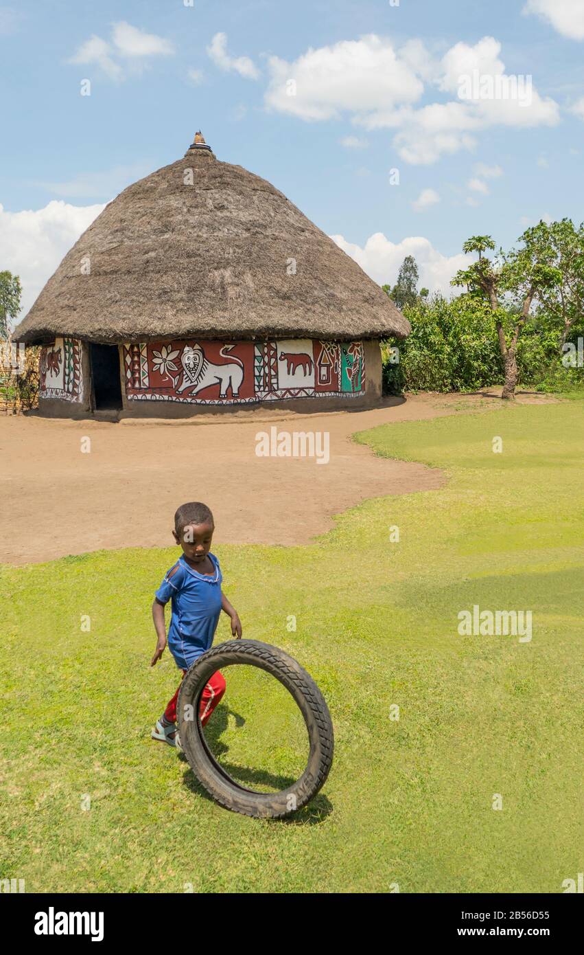 A Traditional Painted Halaba House and an Ethiopia Boy Playing with a ...