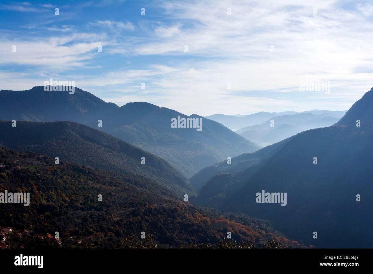 View of misty fog mountains in Arcadia, Greece Stock Photo - Alamy
