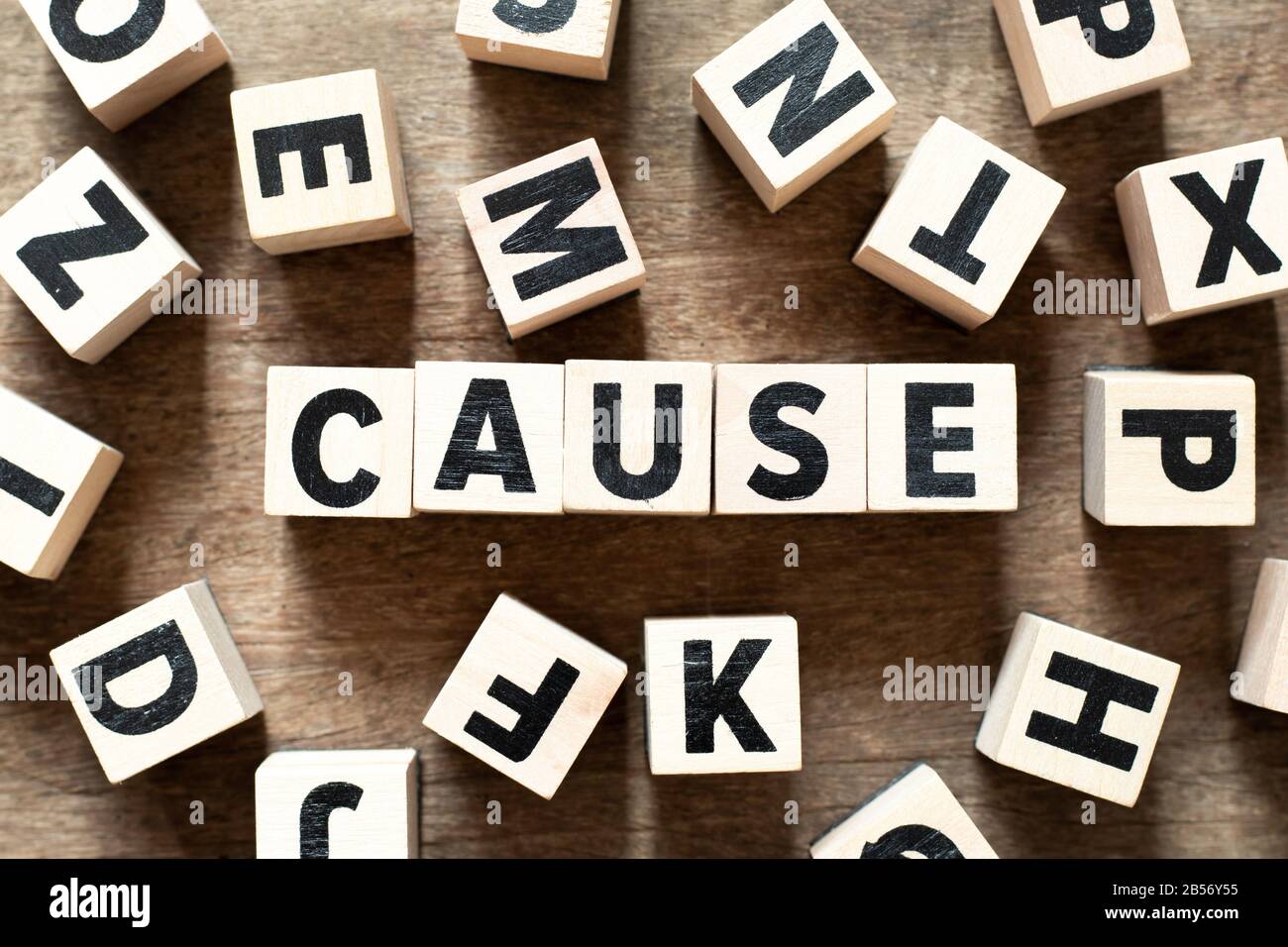 Wood letter block in word cause on wood background with another ...