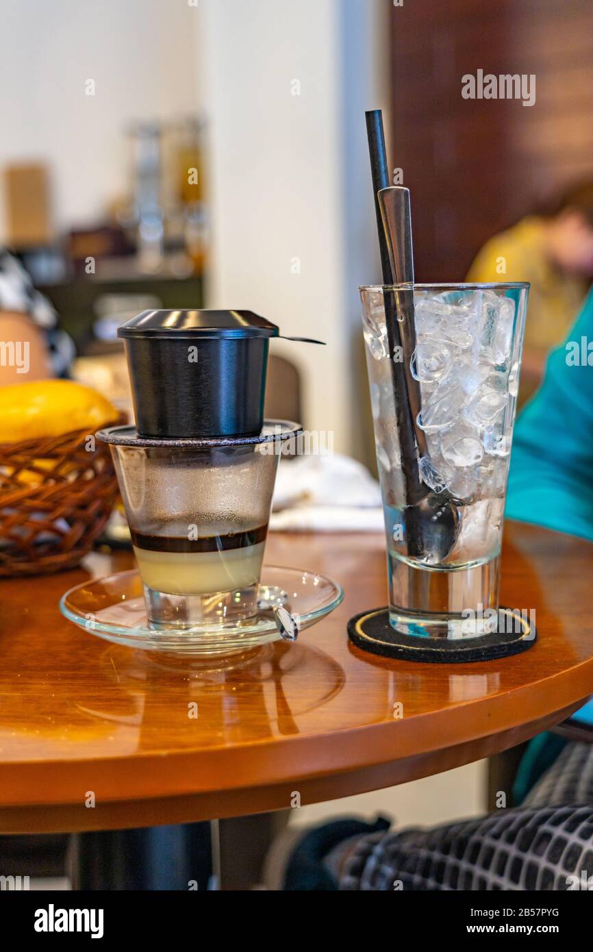 Traditional Vietnamese fin coffee with condensed milk and ice Stock ...