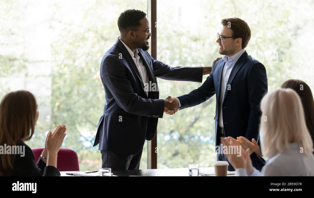 African American businessman handshake male colleague at meeting Stock ...