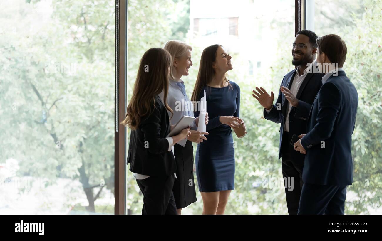 Diverse colleagues smiling talking hi-res stock photography and images ...
