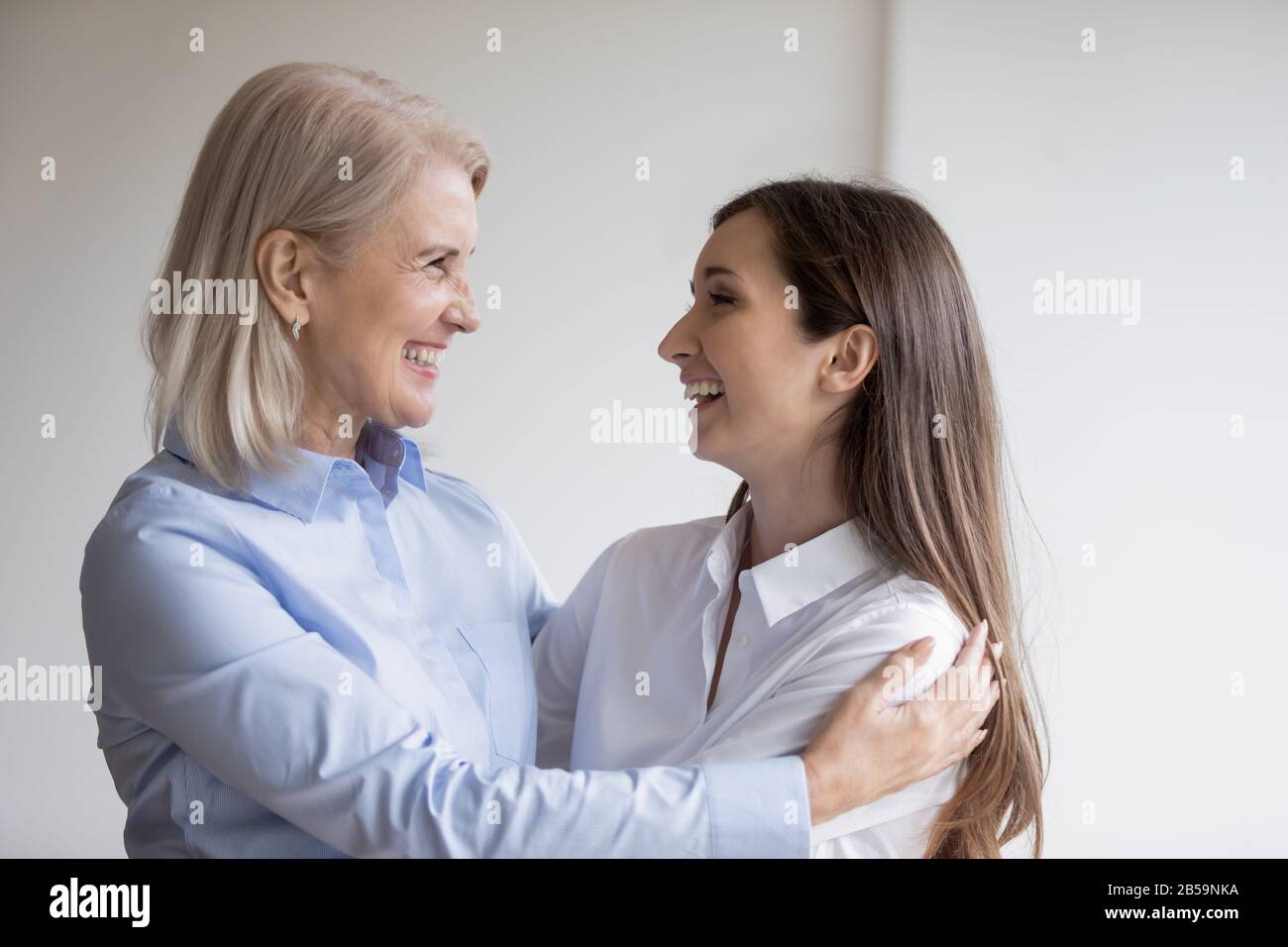 Adult daughter hugging senior mum hi-res stock photography and images - Alamy